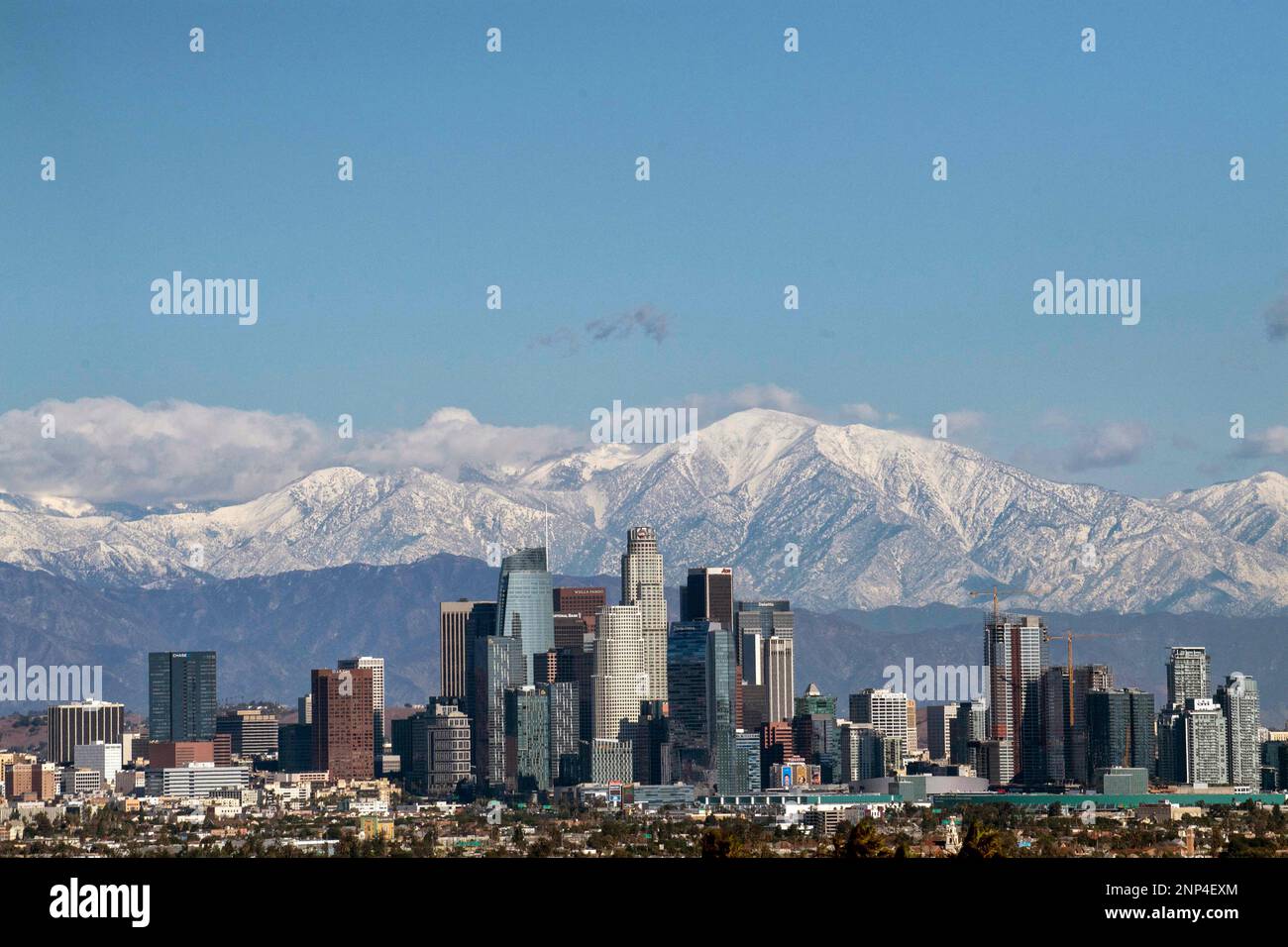 Snow covers the mountains behind downtown Los Angeles, Tuesday, Dec. 29 ...
