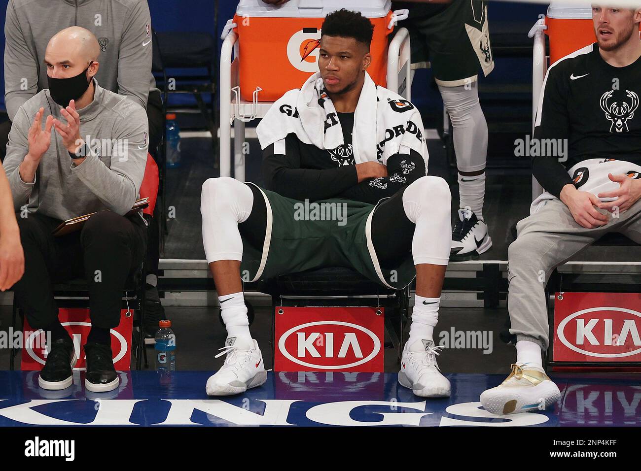 Milwaukee Bucks' Giannis Antetokounmpo, center, looks on from the bench ...