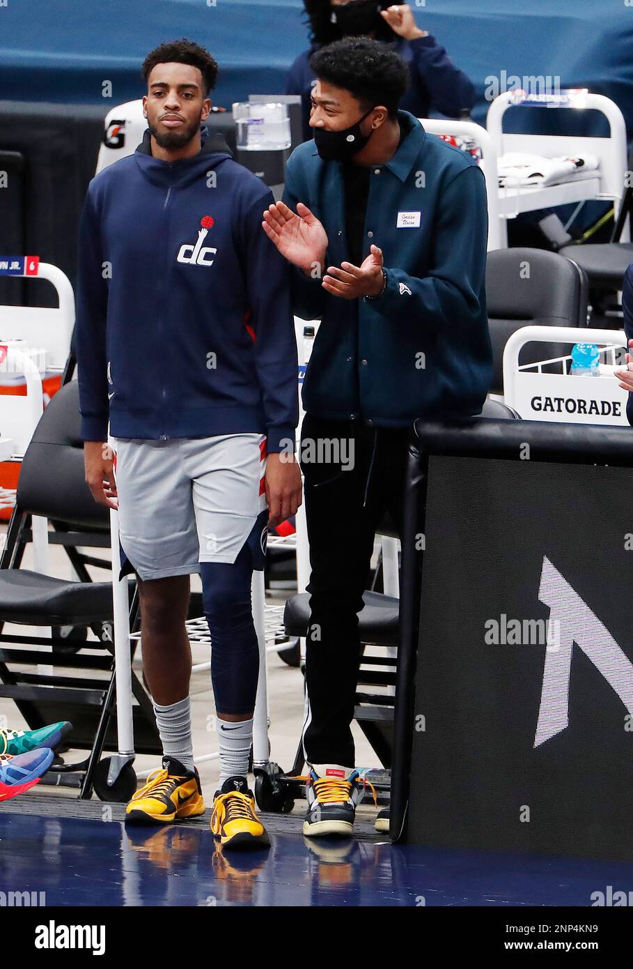 Inactive Washington Wizards player Rui Hachimura, right, applauds as he ...