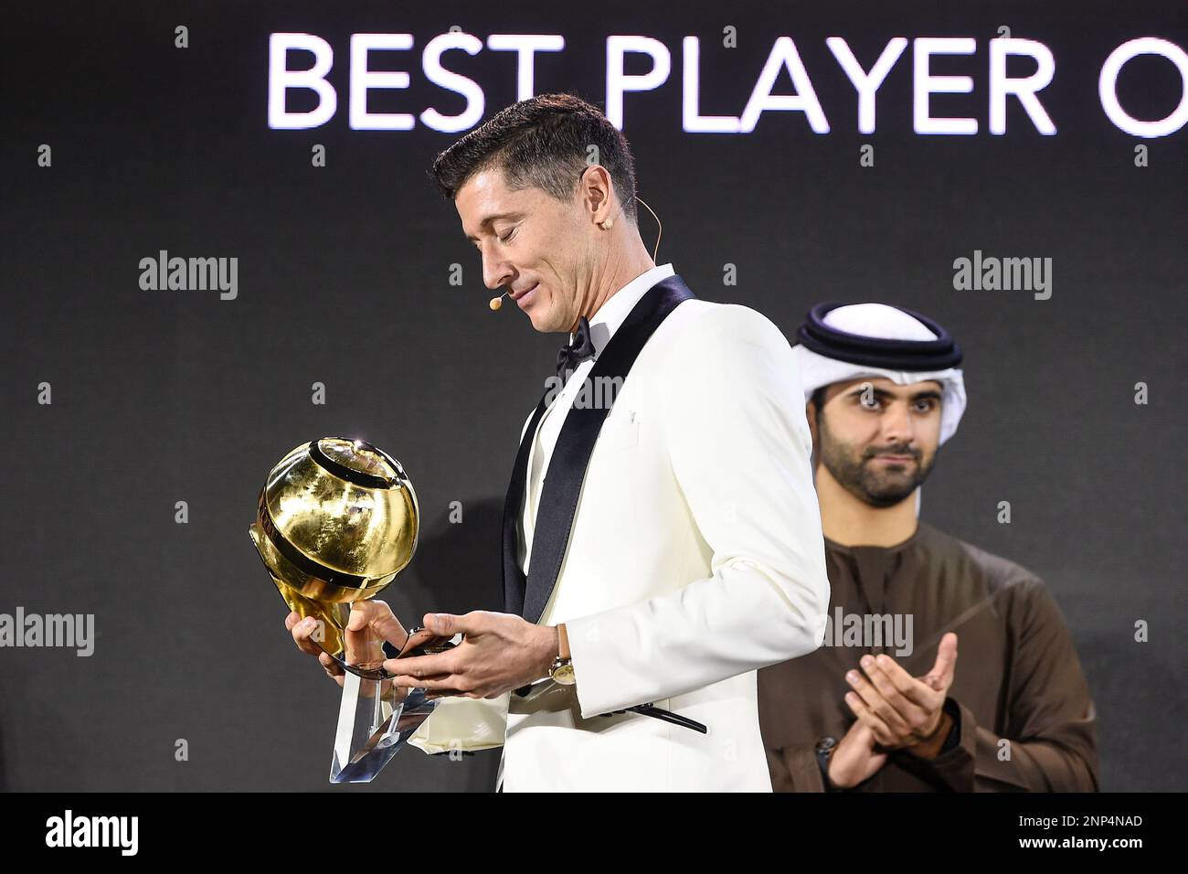Robert Lewandowski holds the trophy for best player of the year, at the ...