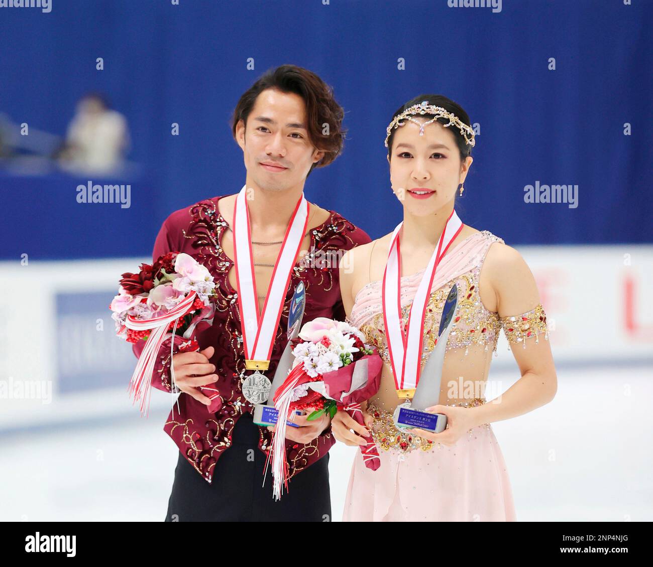 Japanese figure skaters Daisuke Takahashi and Kana Muramoto celebrate after placing 2nd in the ...