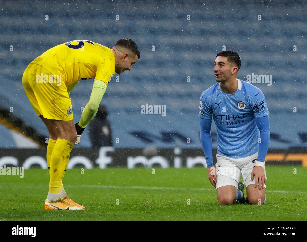 Manchester City's Ferran Torres, right, talks with Newcastle's ...