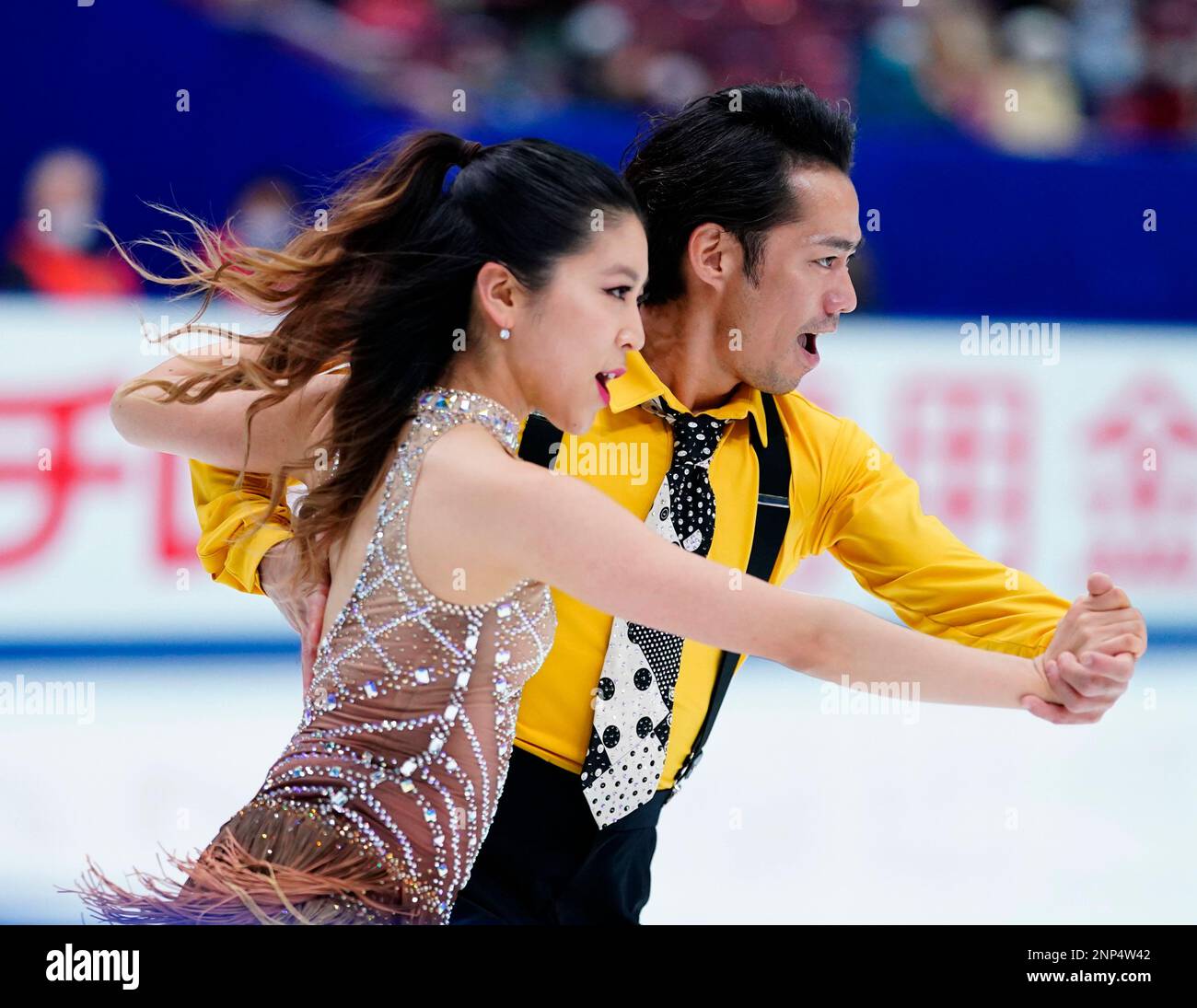 Japanese figure skaters Daisuke Takahashi and Kana Muramoto perform during the Rhythm Danceof ...