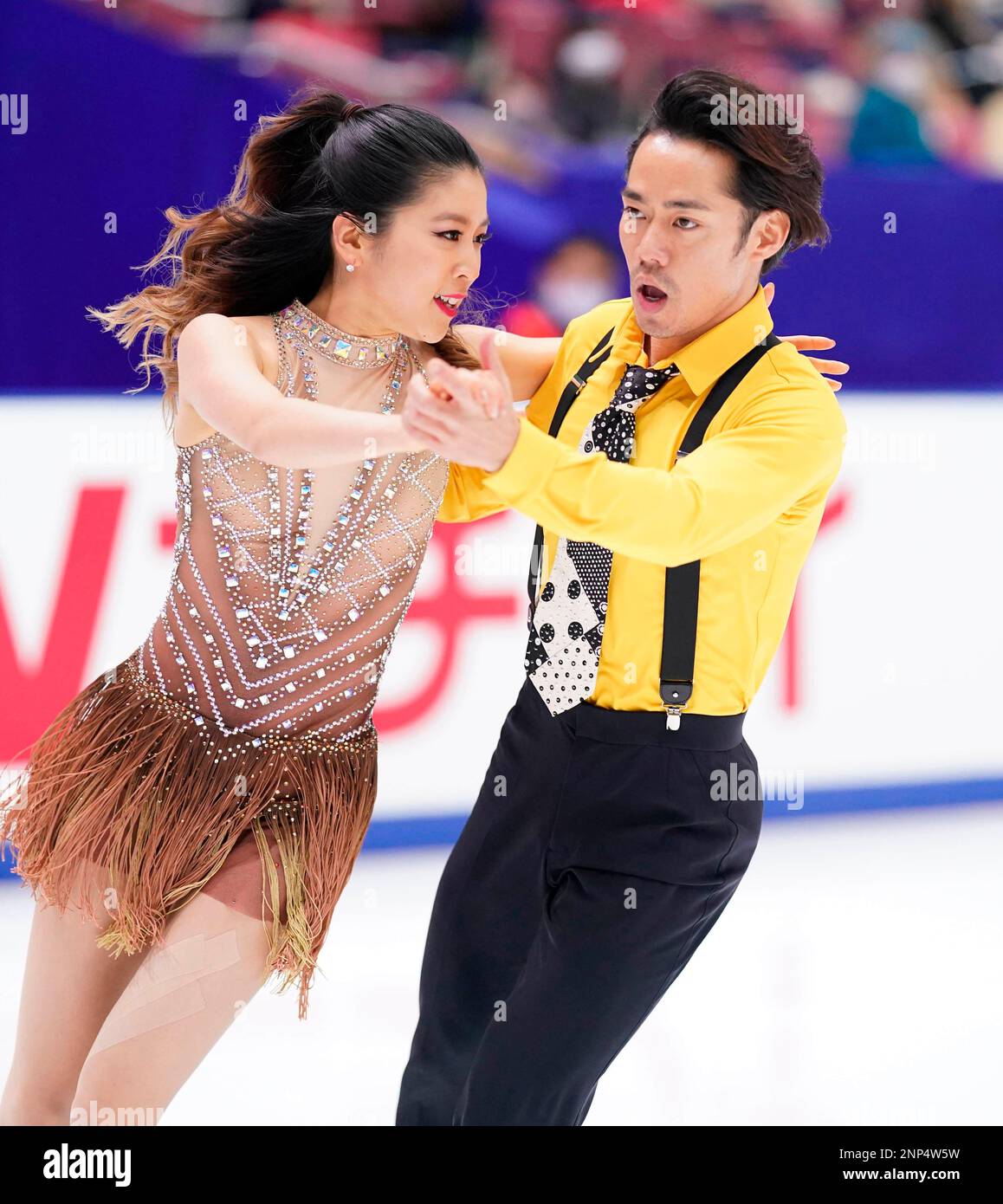 Japanese figure skaters Daisuke Takahashi and Kana Muramoto perform during the Rhythm Danceof ...