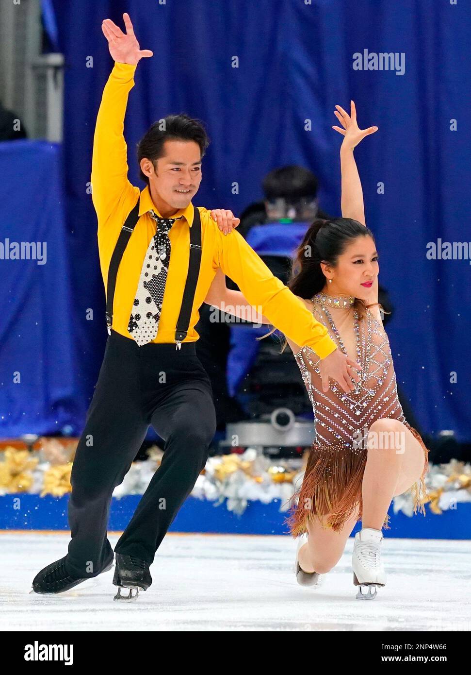 Japanese figure skaters Daisuke Takahashi and Kana Muramoto perform during the Rhythm Danceof ...