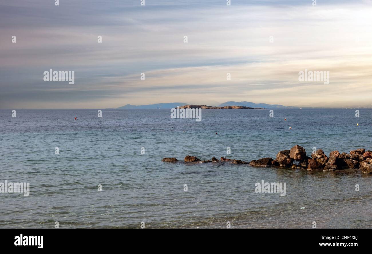 Greek seascape. Calm blue sea, rocky formation in transparent water ...