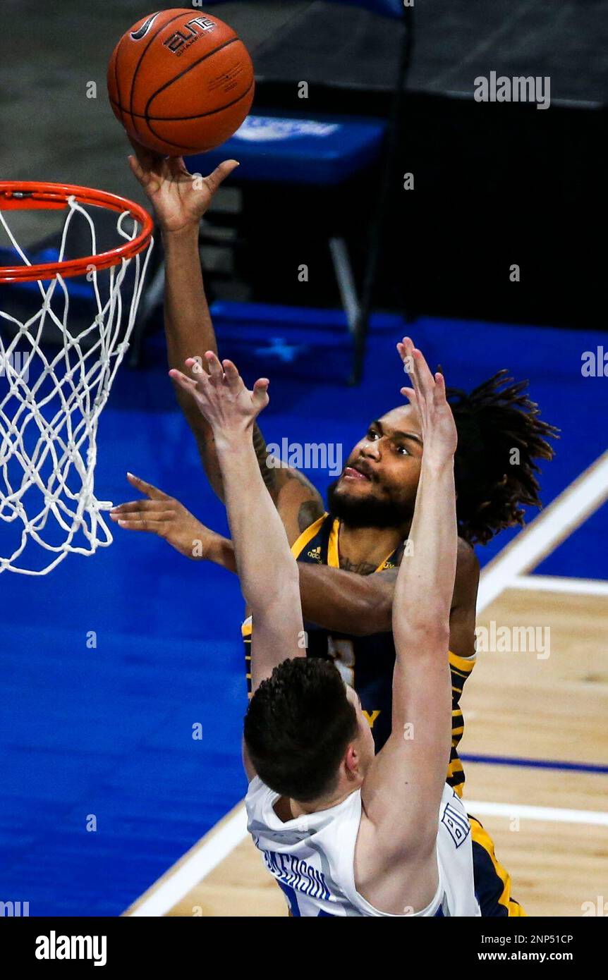 UMKC guard Brandon McKissic (3) makes a layup over Saint Louis guard ...