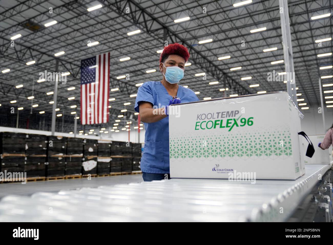Boxes containing the Moderna COVID-19 vaccine are prepared to be ...