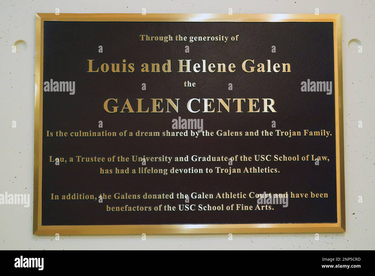 A plaque honoring Lou Galen and Helene Galan at the Galen Center ...