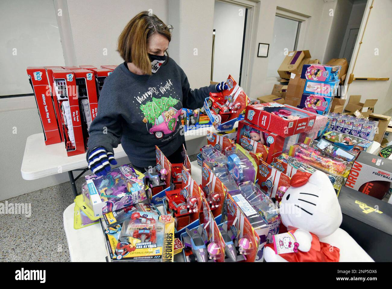 Susan McRoy looks for age appropriate toys to hand out during the ...