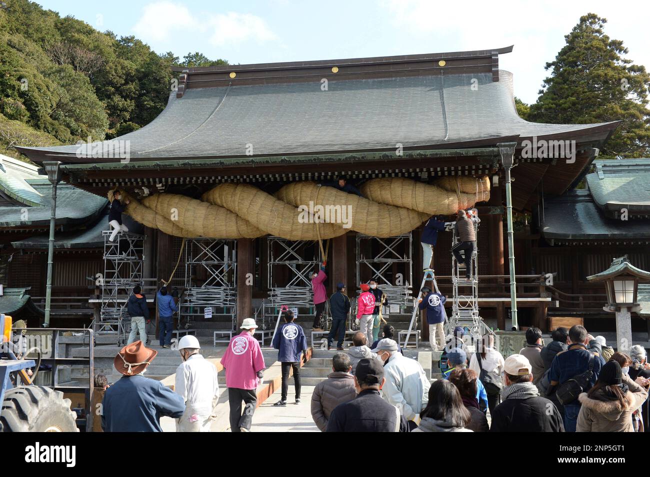 O-shimenawa, a huge sacred Shinto rice straw festoon, is set on the ...