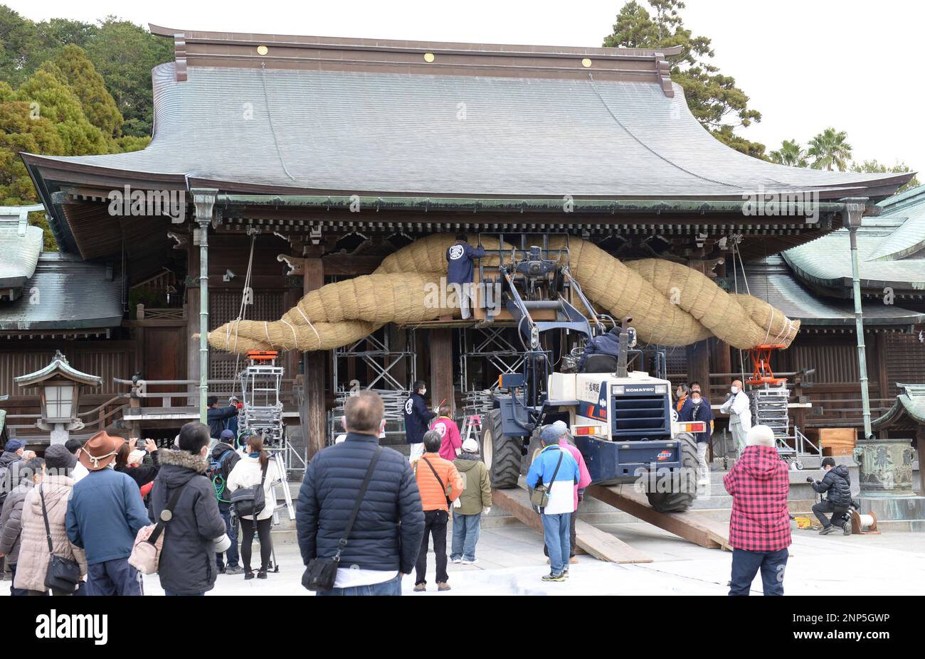 O-shimenawa, a huge sacred Shinto rice straw festoon, is set on the ...
