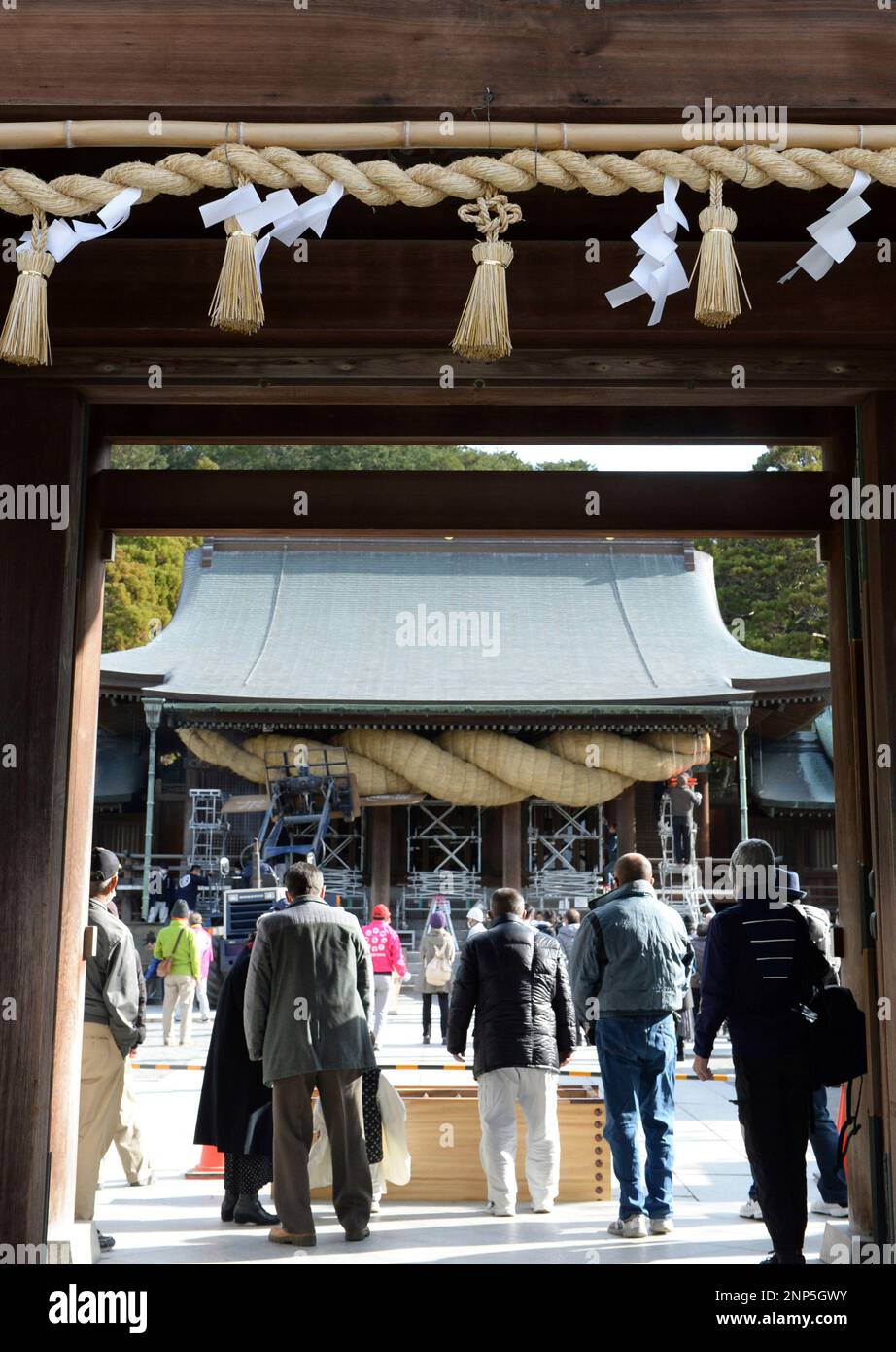 O-shimenawa, a huge sacred Shinto rice straw festoon, is set on the ...