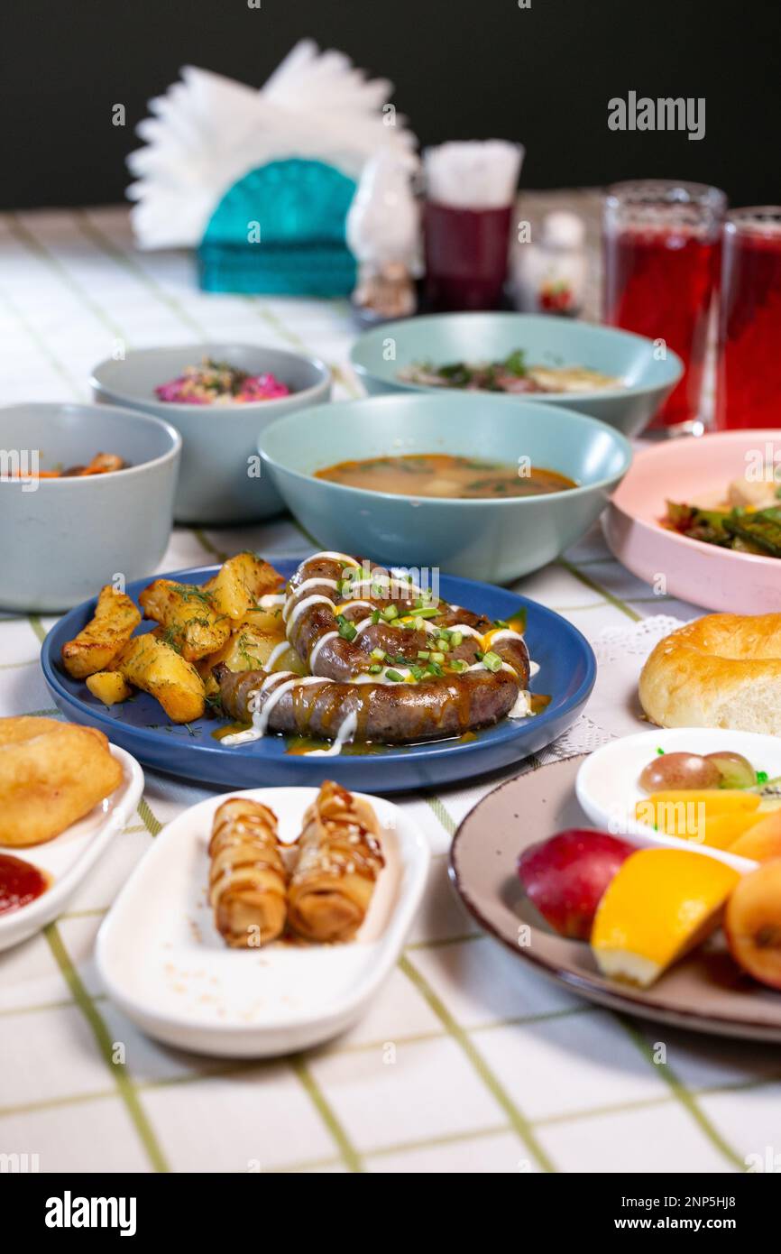 a dining table with different food served in a cafe or restaurant Stock ...