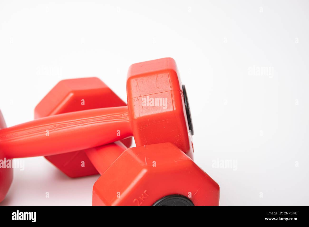 Red dumbbell for fitness isolated on white background Stock Photo - Alamy