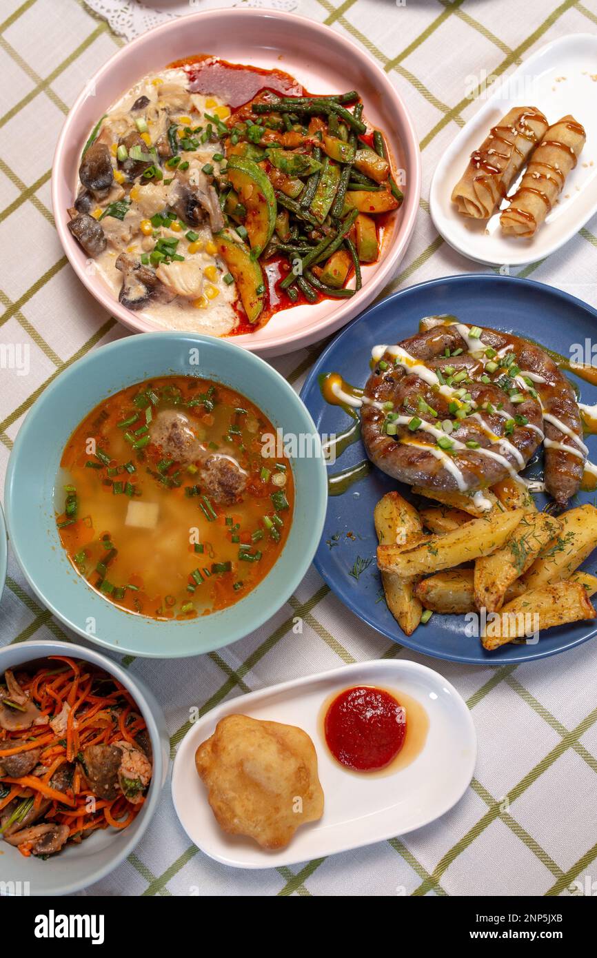 Top view of the dining table with delicious dishes served in a cafe or ...