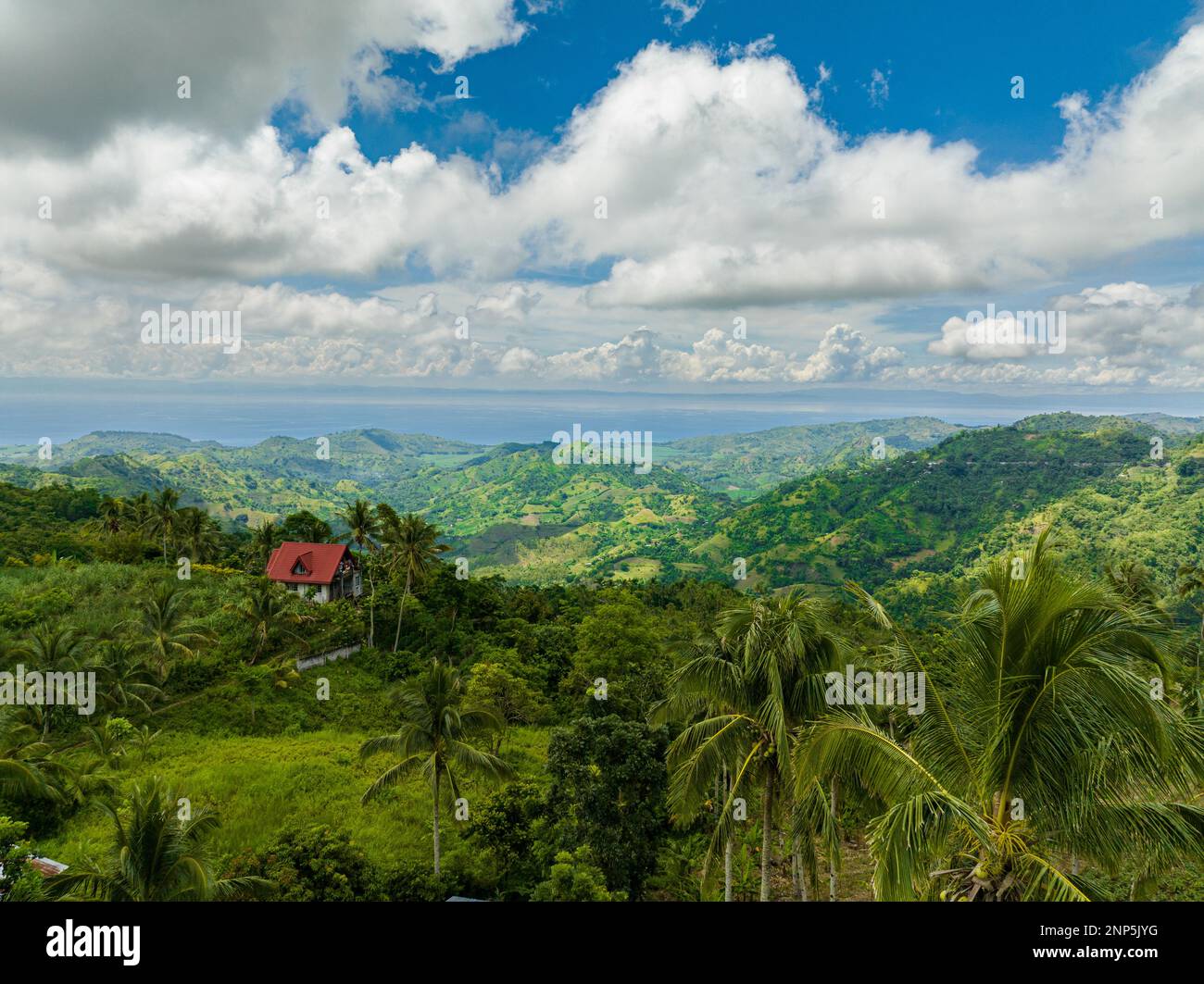 Aerial drone of mountain landscape with green hills and farmland ...