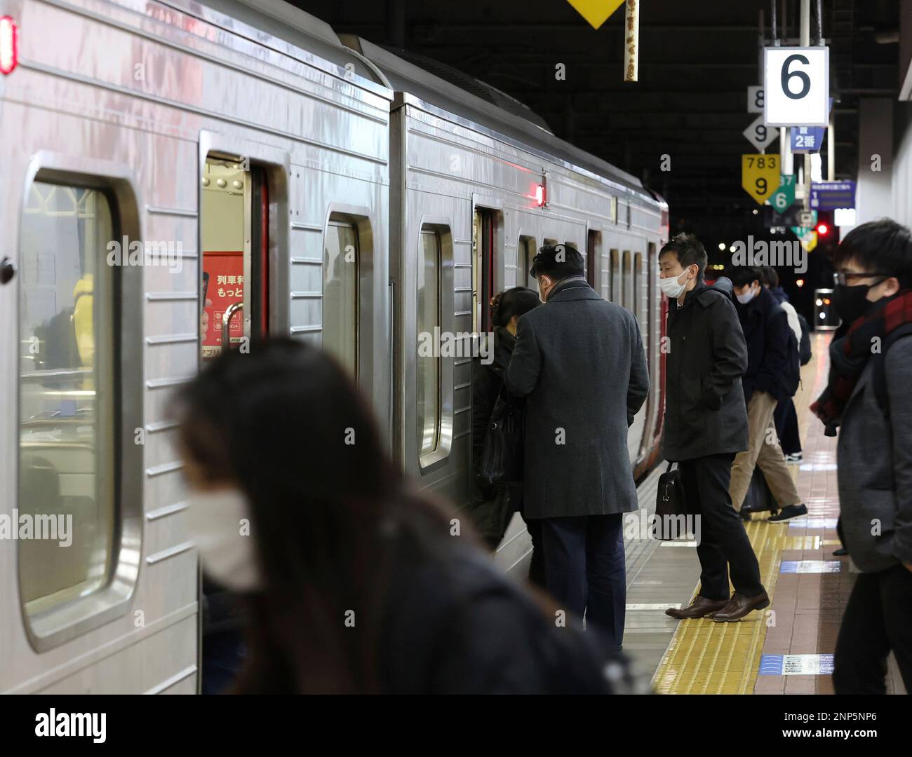 Passengers get into the last train at JR Hakata Station in Fukuoka on ...