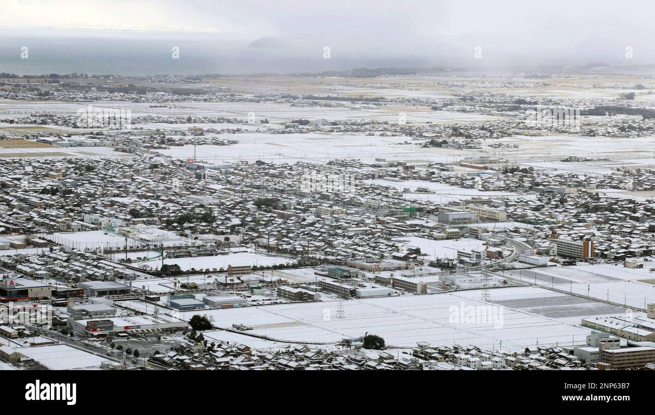 An aerial photo shows an urban area being lightly dusted in eastern ...