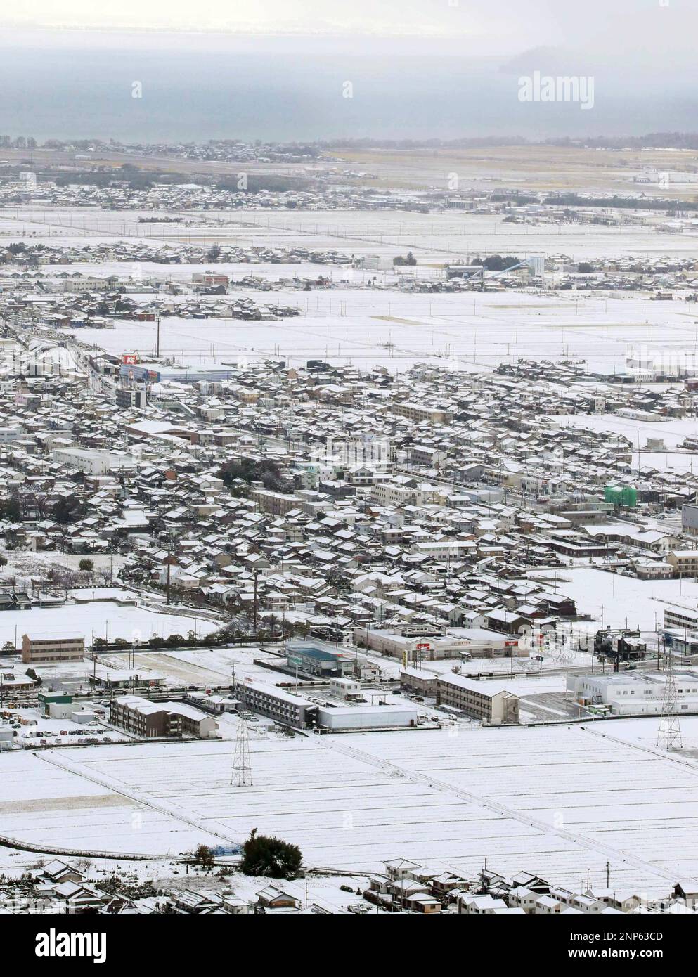 An aerial photo shows an urban area being lightly dusted in eastern ...