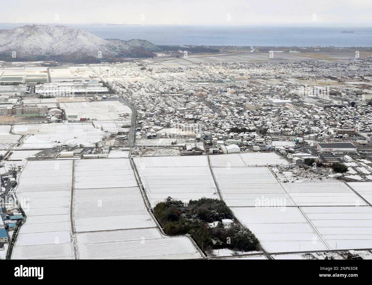 An aerial photo shows an urban area being lightly dusted in eastern ...