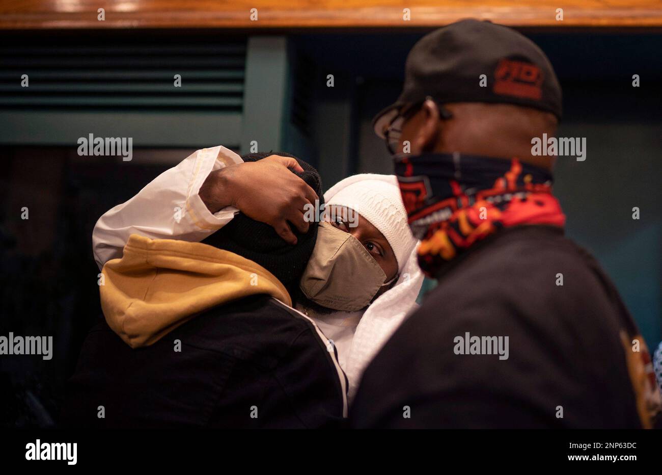 Myon Burrell embraces his son, Myon Jr., moments after he was released ...