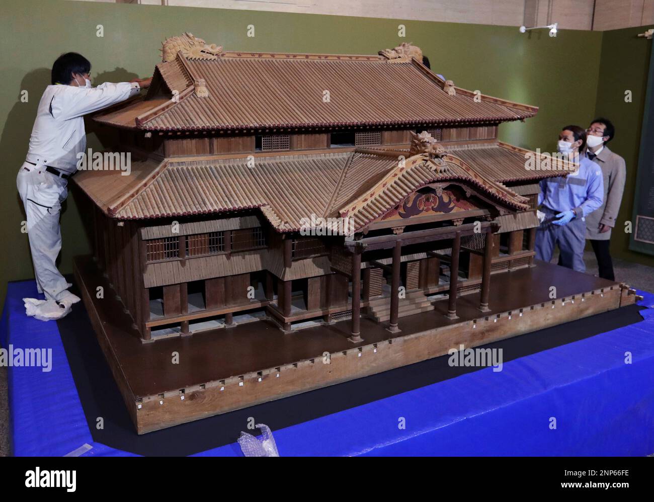 A model of Shuri Castle is brought into the Tokyo National Museum in ...