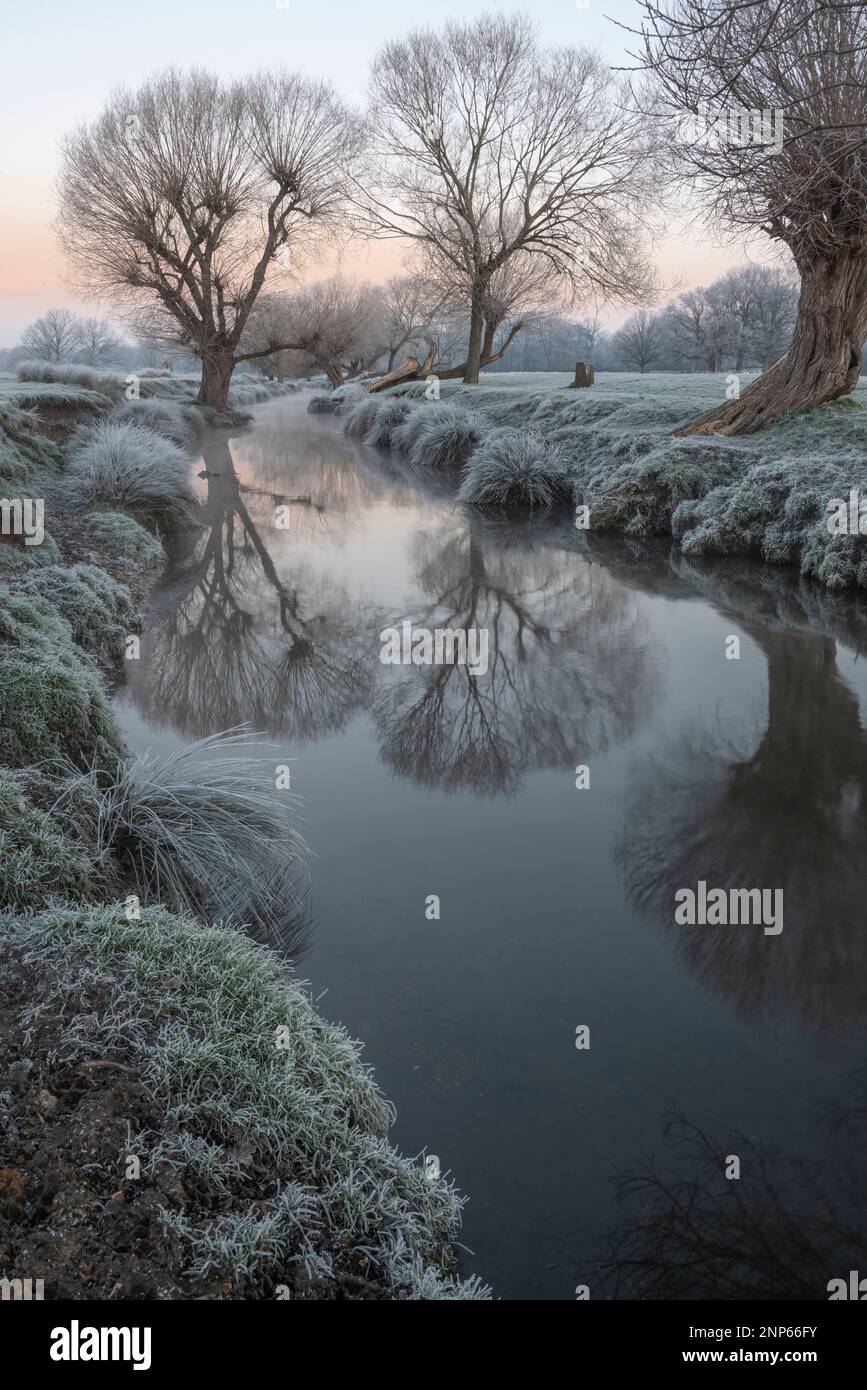 Beautiful Winter sunrise landscape image at dawn with hoarfrost on the ...