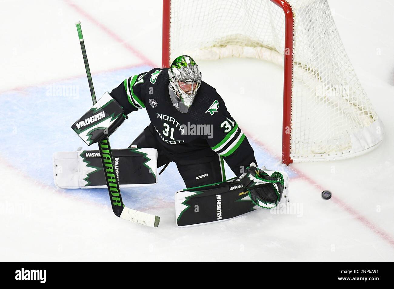 December 10, 2020 The puck is shot wide of North Dakota Fighting Hawks ...