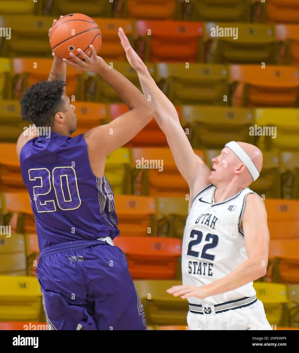 College of Idaho forward Jalen Galloway (20) shoots as Utah State guard ...