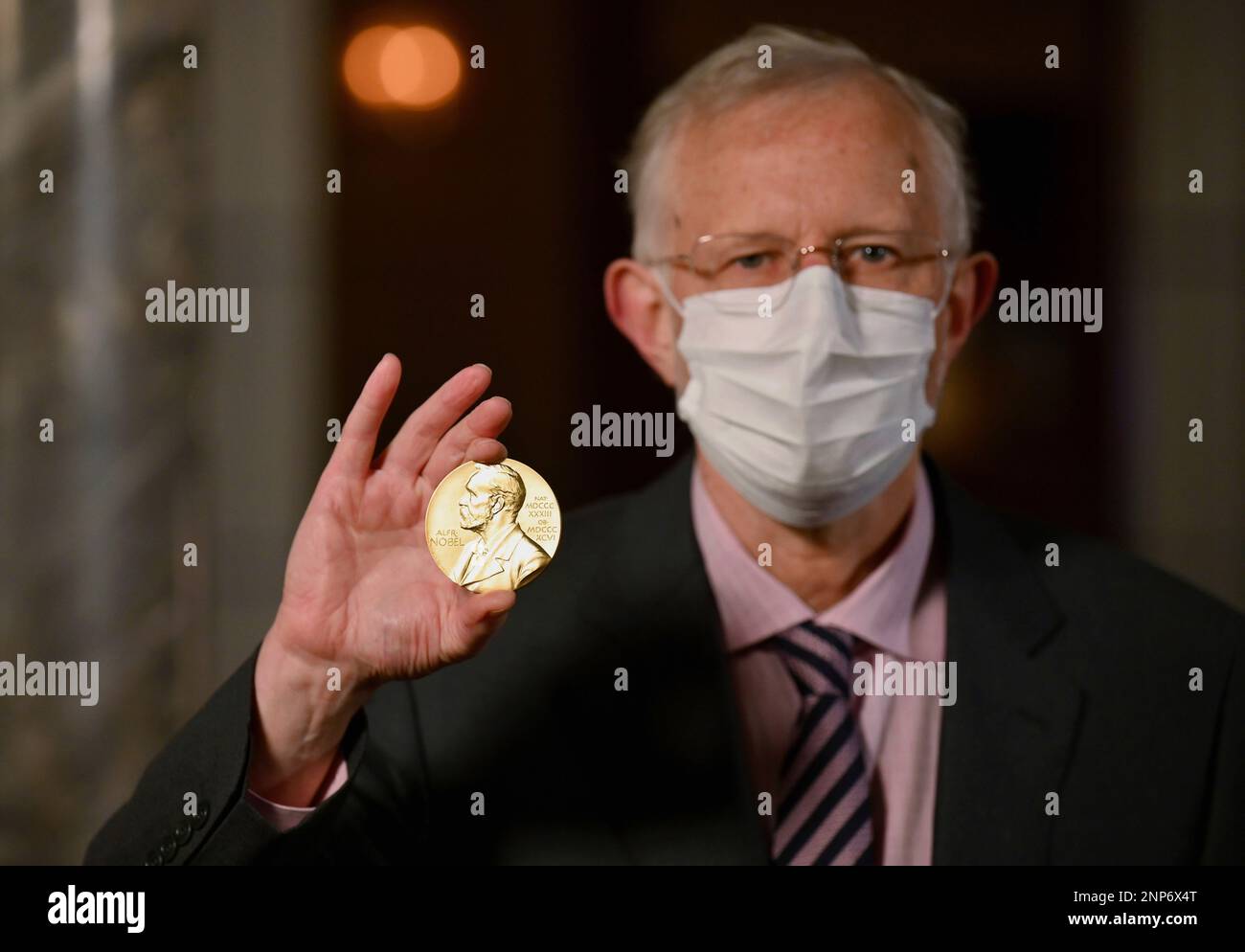 Charles M. Rice poses with his Nobel prize medal in physiology or ...