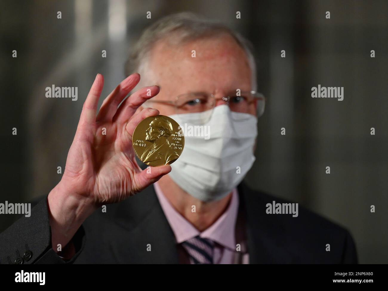 Charles M. Rice poses Nobel prize medal in physiology or medicine ...