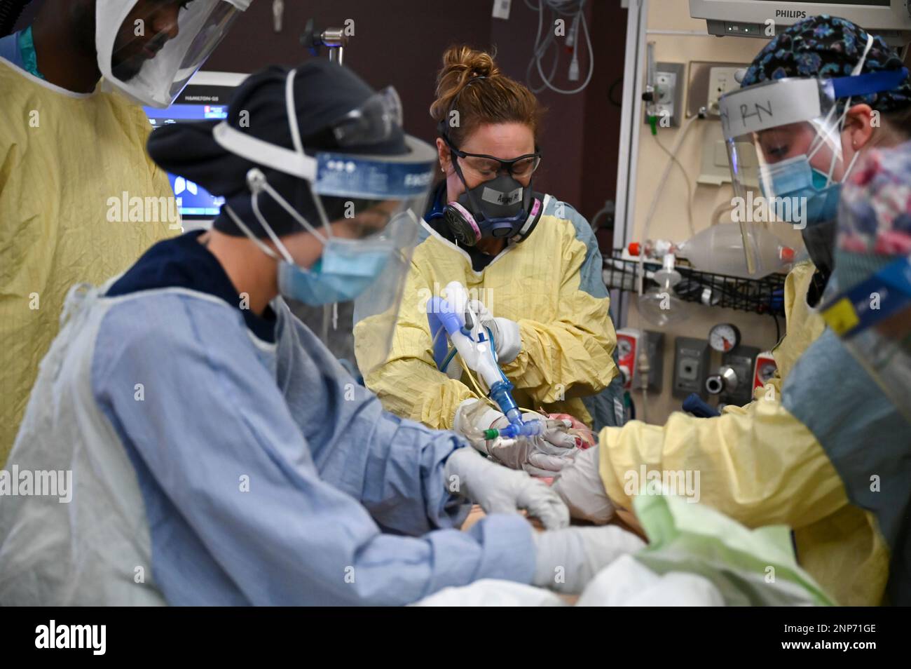 North Memorial respiratory therapist Audrey Olson, center, repositions ...
