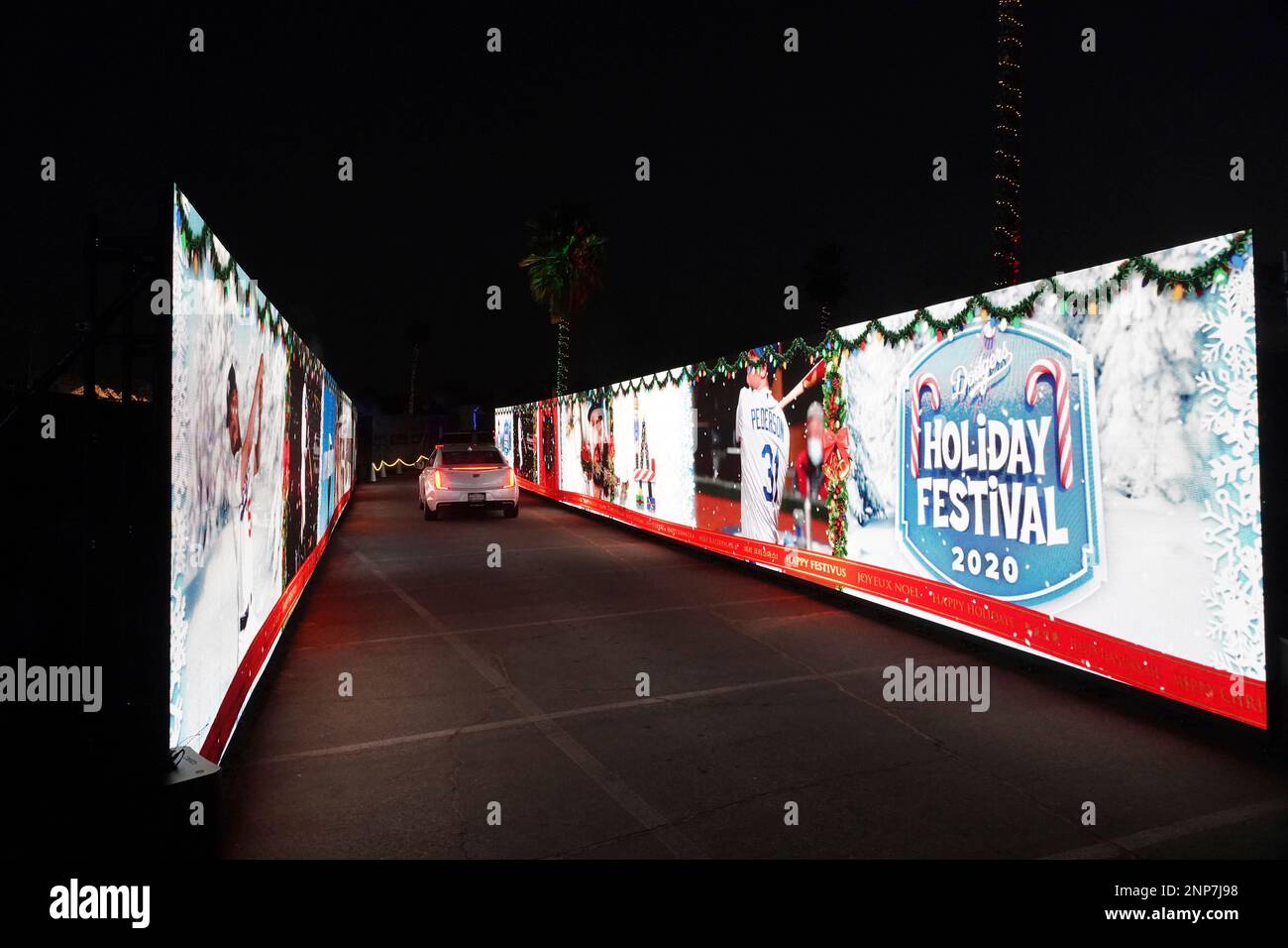 Motorists drive through LED video display at the Los Angeles Dodgers ...
