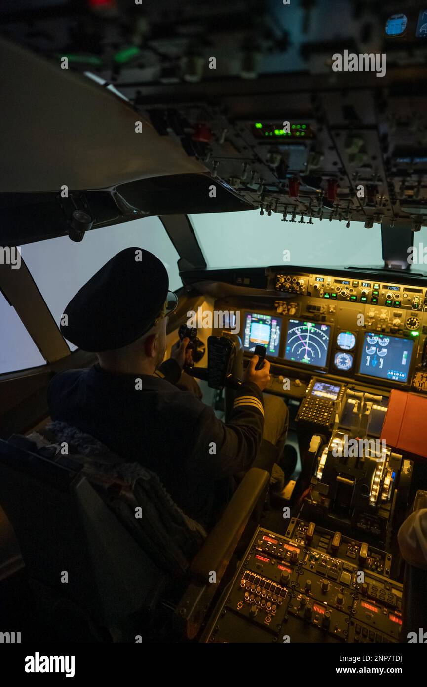 A man is studying to be a pilot in an aircraft simulator Stock Photo ...