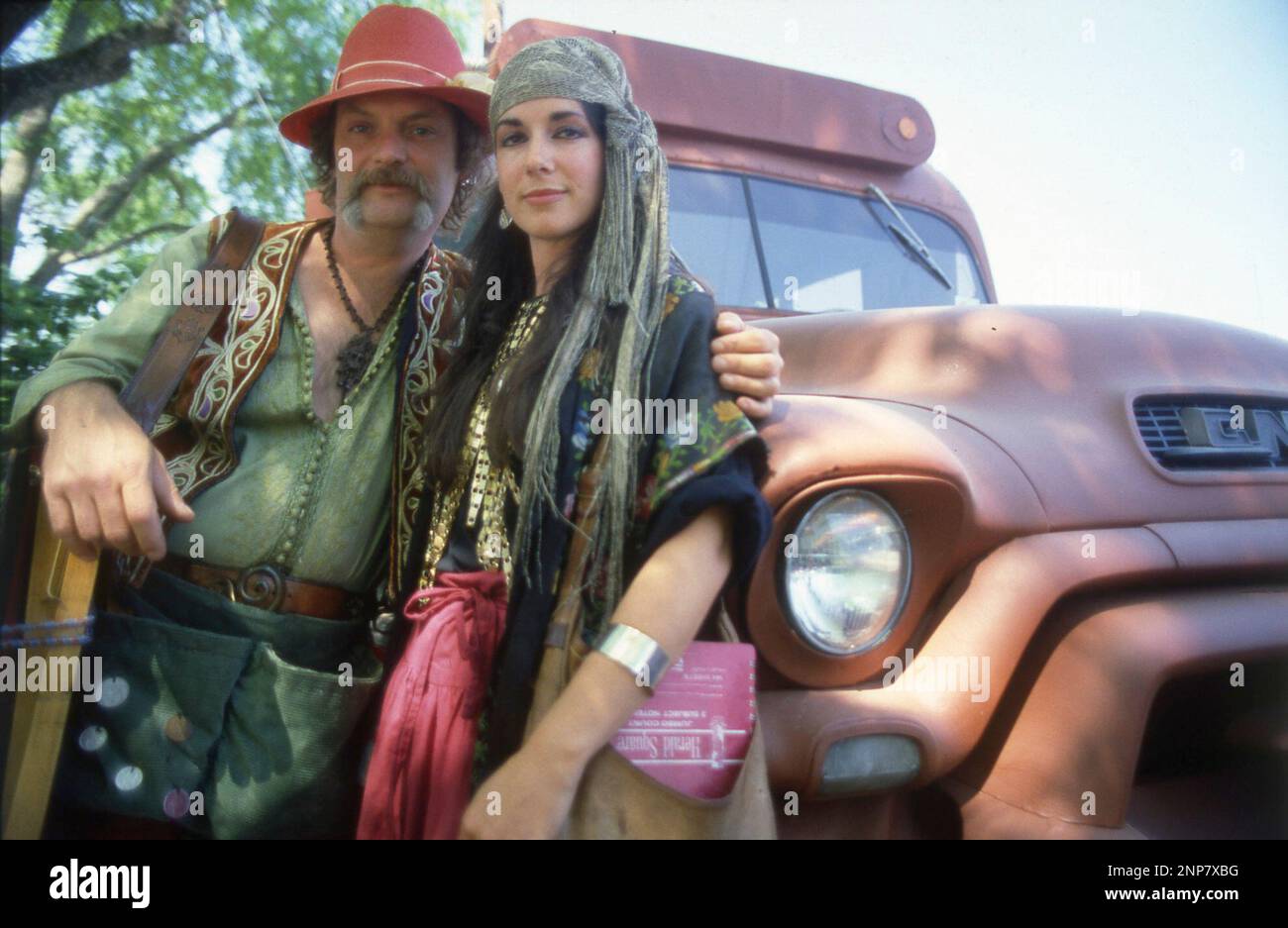 Magician Cellini and wife Eileen stand outside their bus home before ...