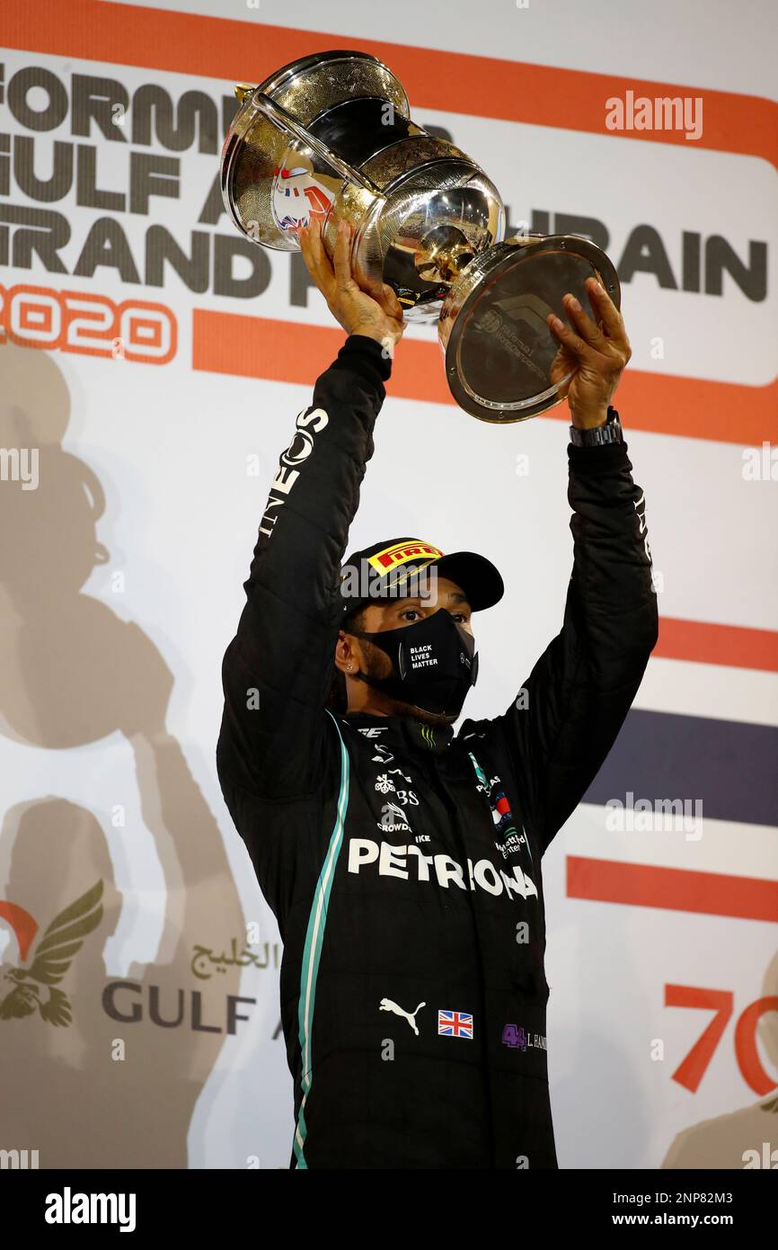 Mercedes driver Lewis Hamilton of Britain lifts the trophy on the ...