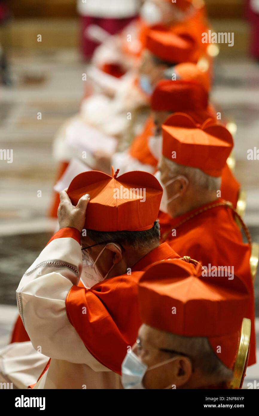 Cardinals wear protective masks during a consistory ceremony where 13 ...
