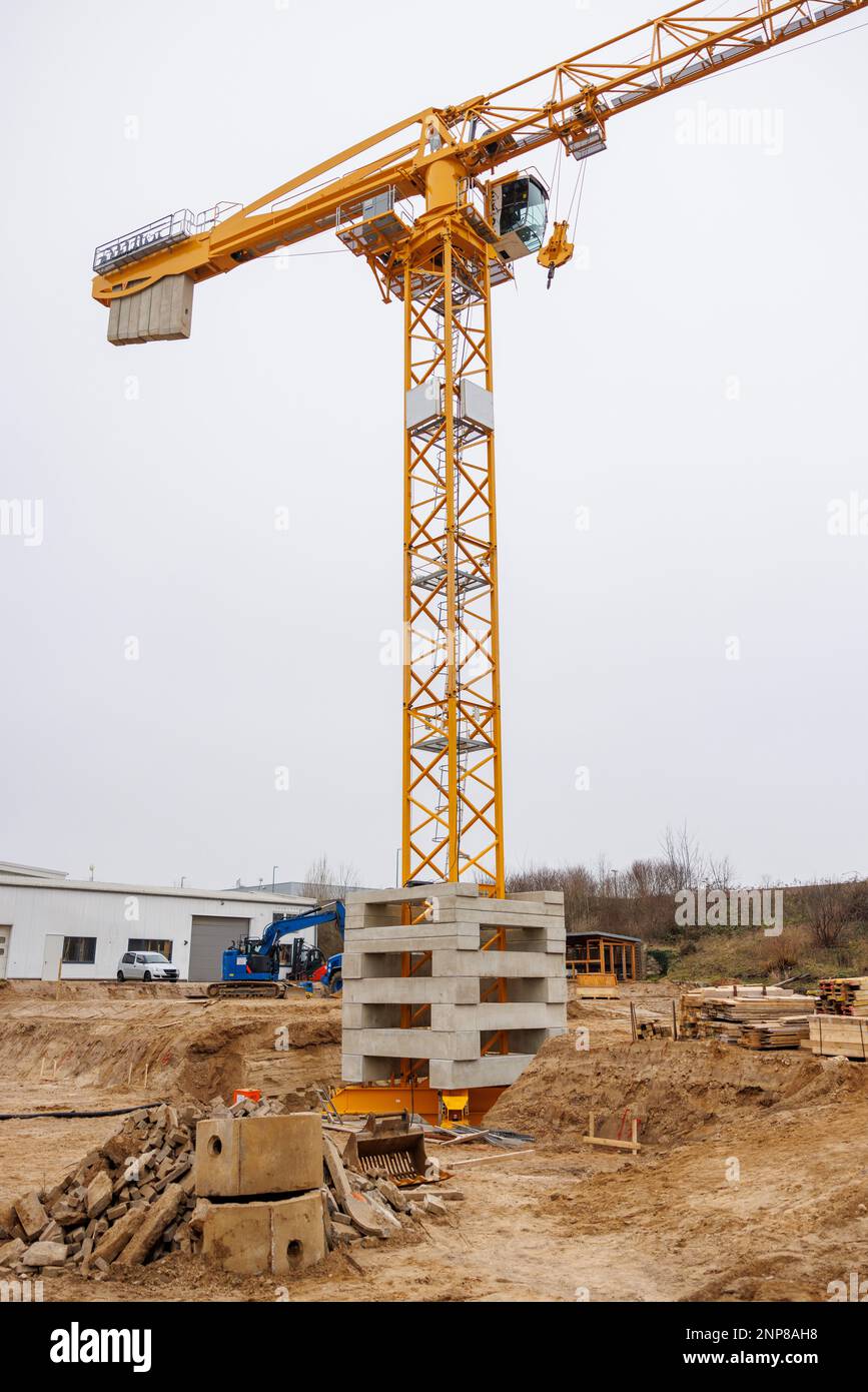 a construction crane stands on a building site Stock Photo - Alamy