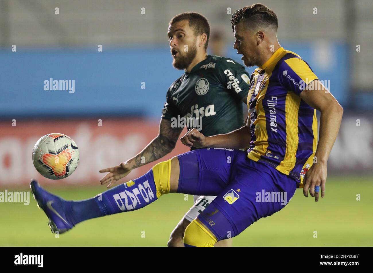 Carlos Rodriguez of Ecuador's Delfin, right, and Lucas Lima of Brazil's ...