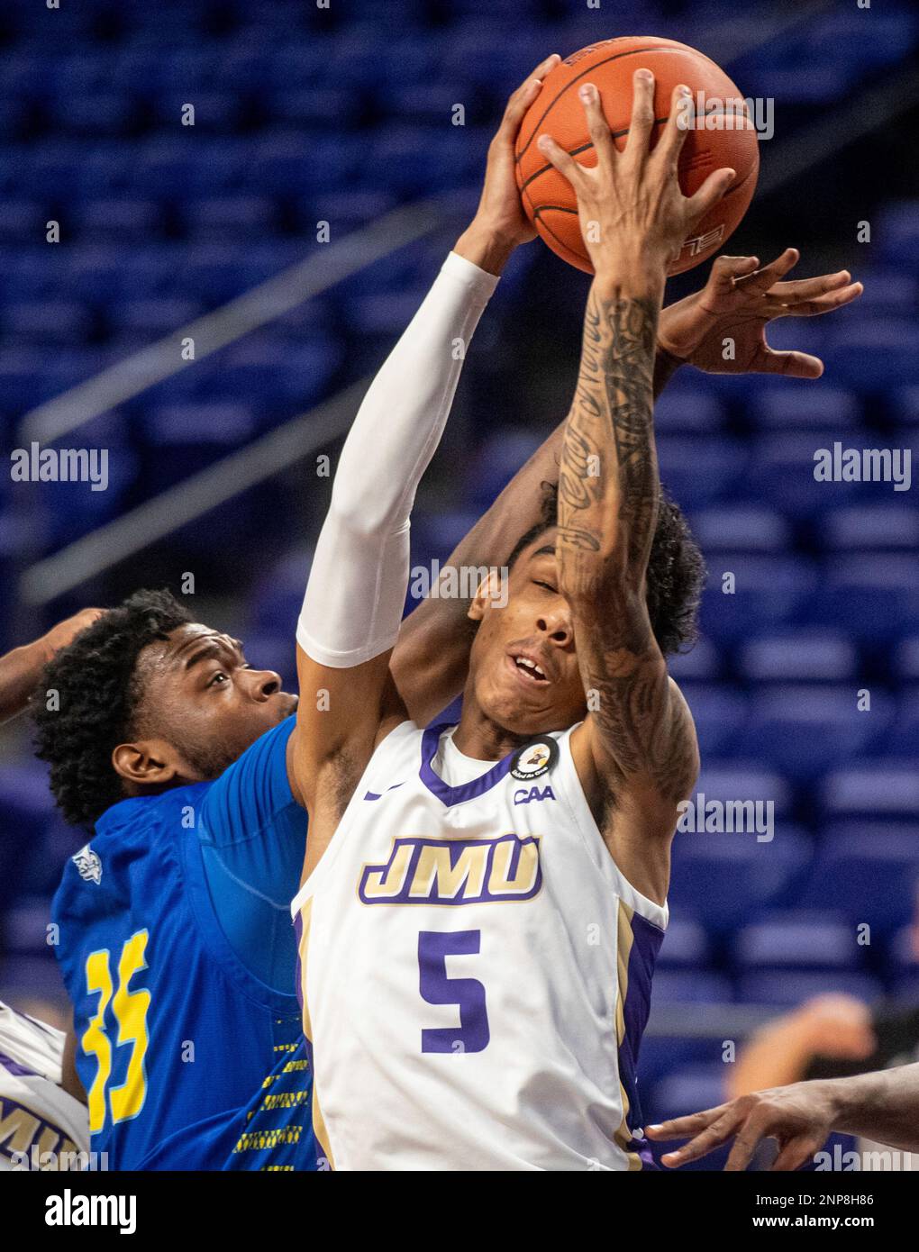 James Madison guard Terrence Edwards (5) grabs a rebound against ...