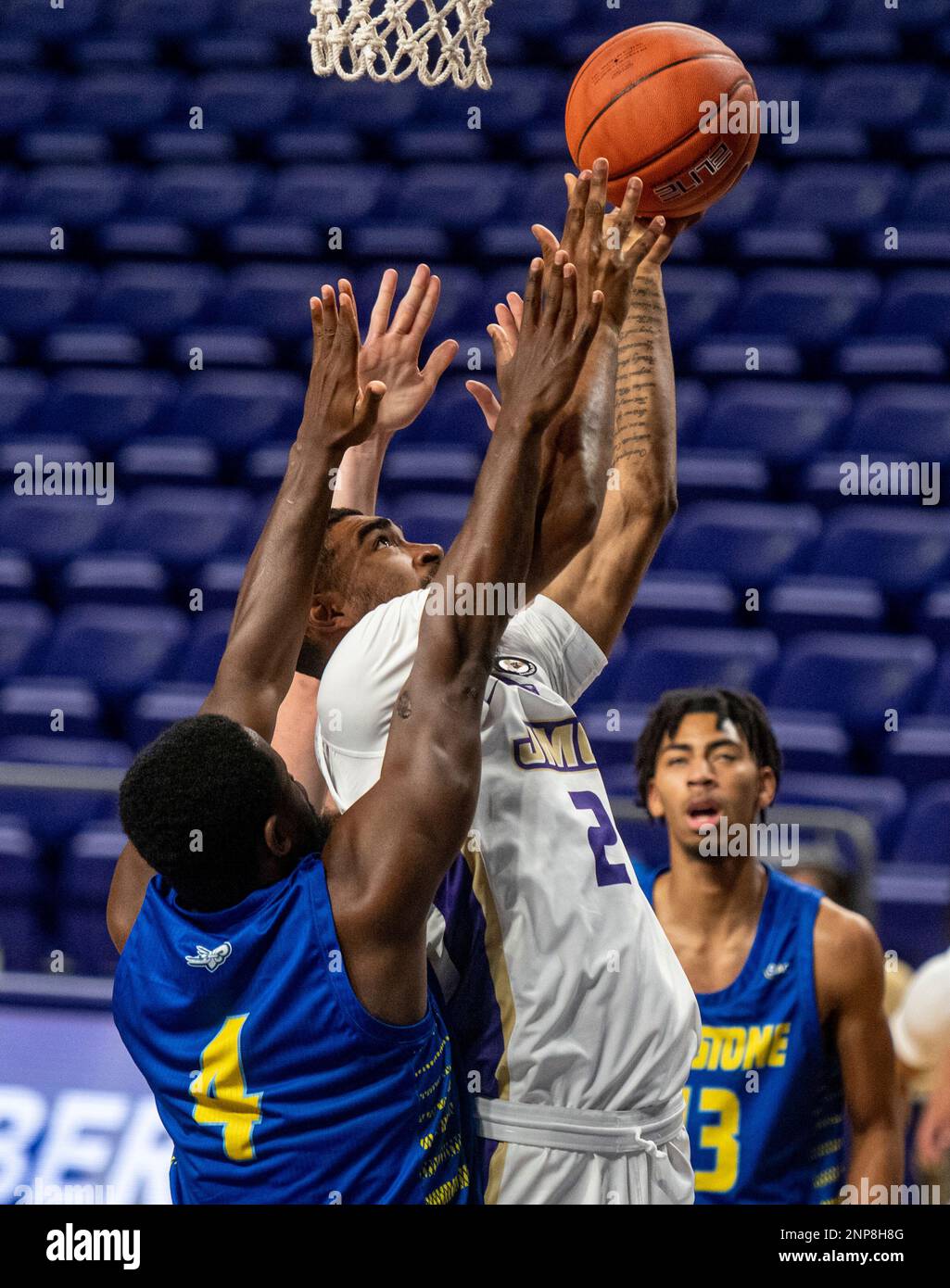 James Madison guard TJ Taylor (2) goes up for a shot against Limestone ...