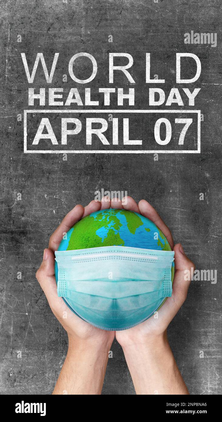 Human hand showing earth with a face mask. World Health Day Concept ...