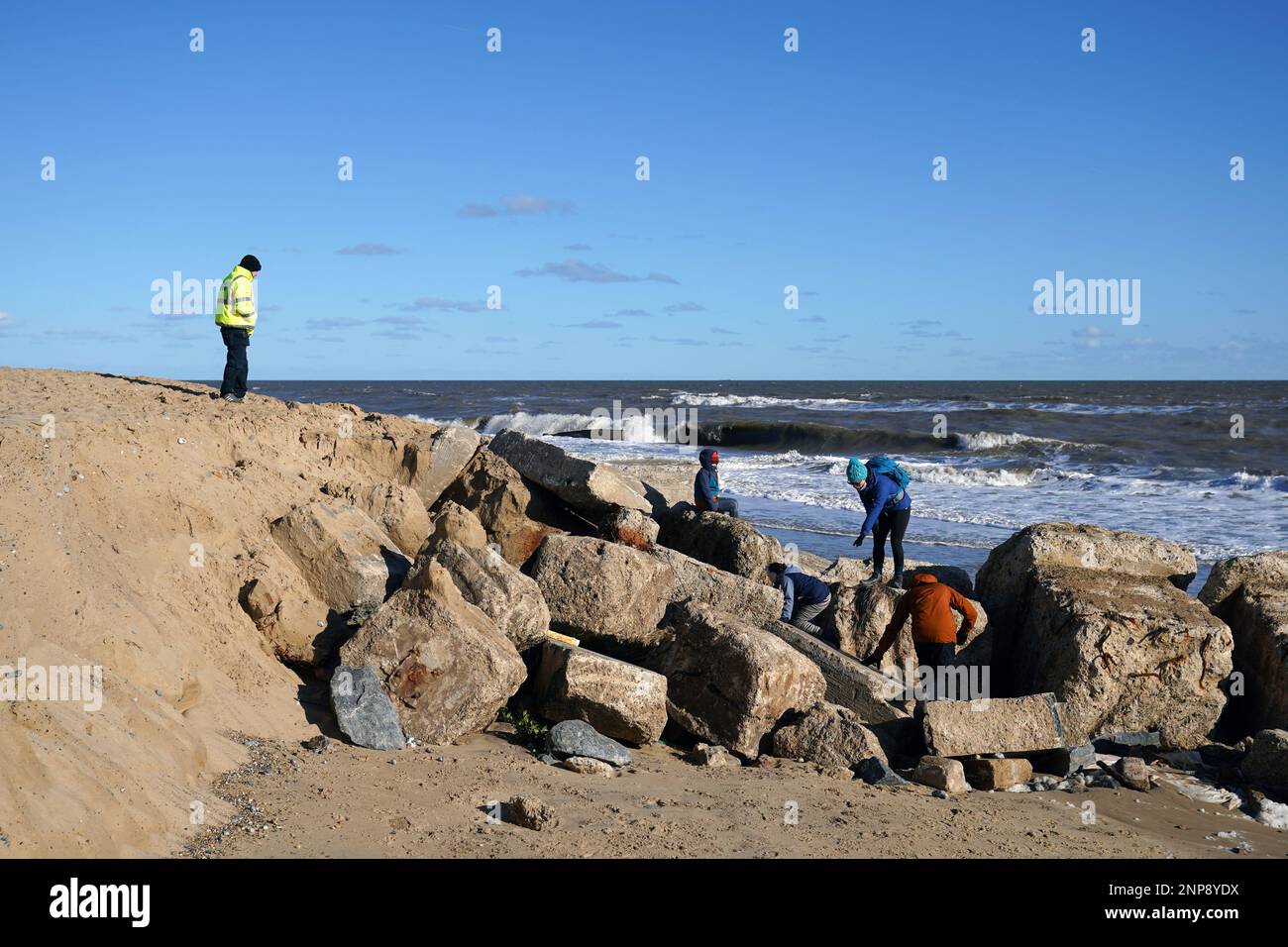 People climb off the beach at Hemsby in Norfolk, which has been closed ...