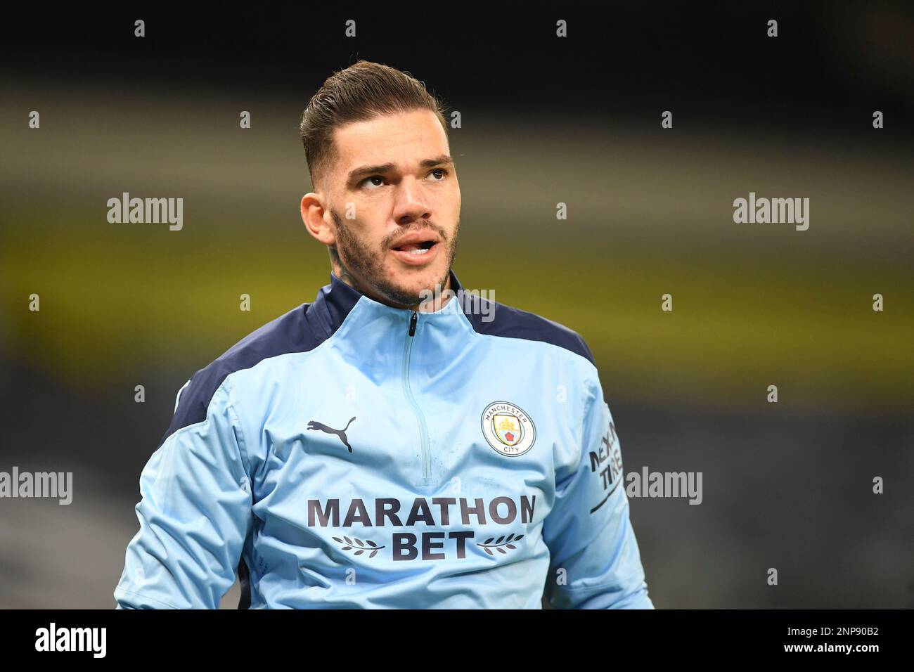 Manchester City's goalkeeper Ederson warms up ahead of the English ...