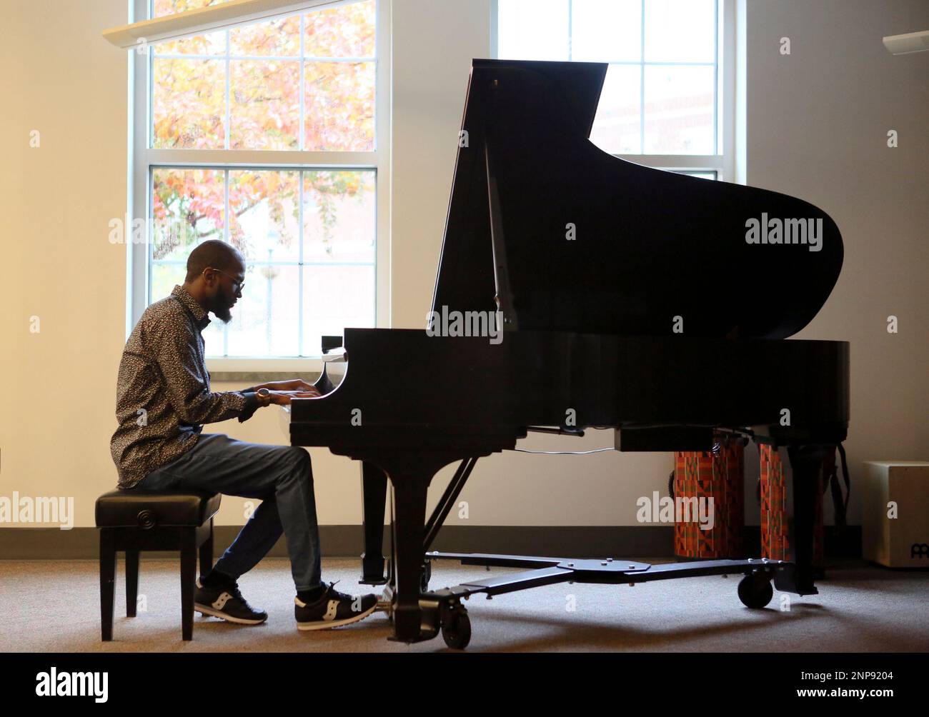 Terrance Shepherd plays piano in a piano lab on the Radford University ...