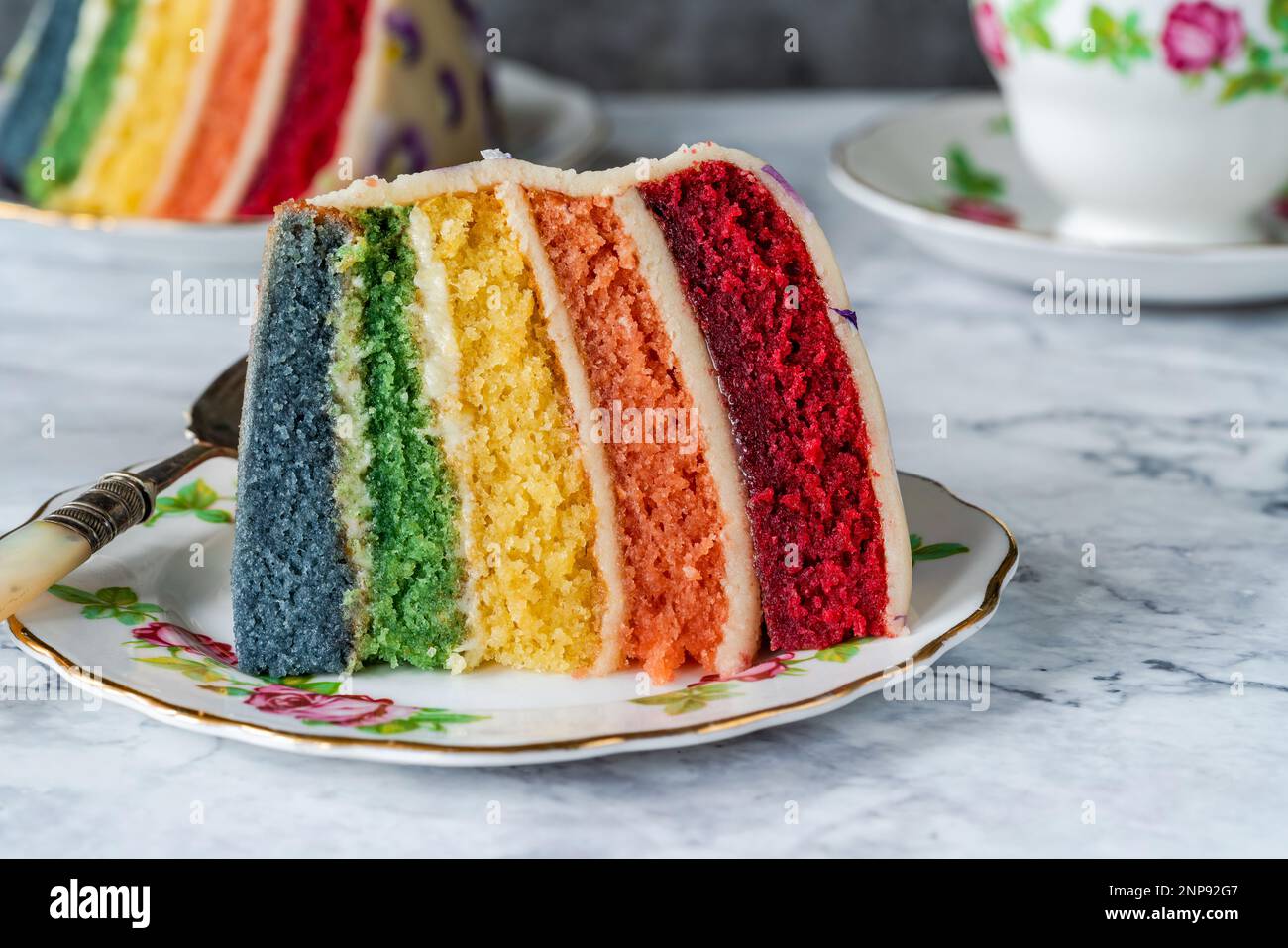 Multi layered rainbow cake - sweet afternoon dessert Stock Photo - Alamy