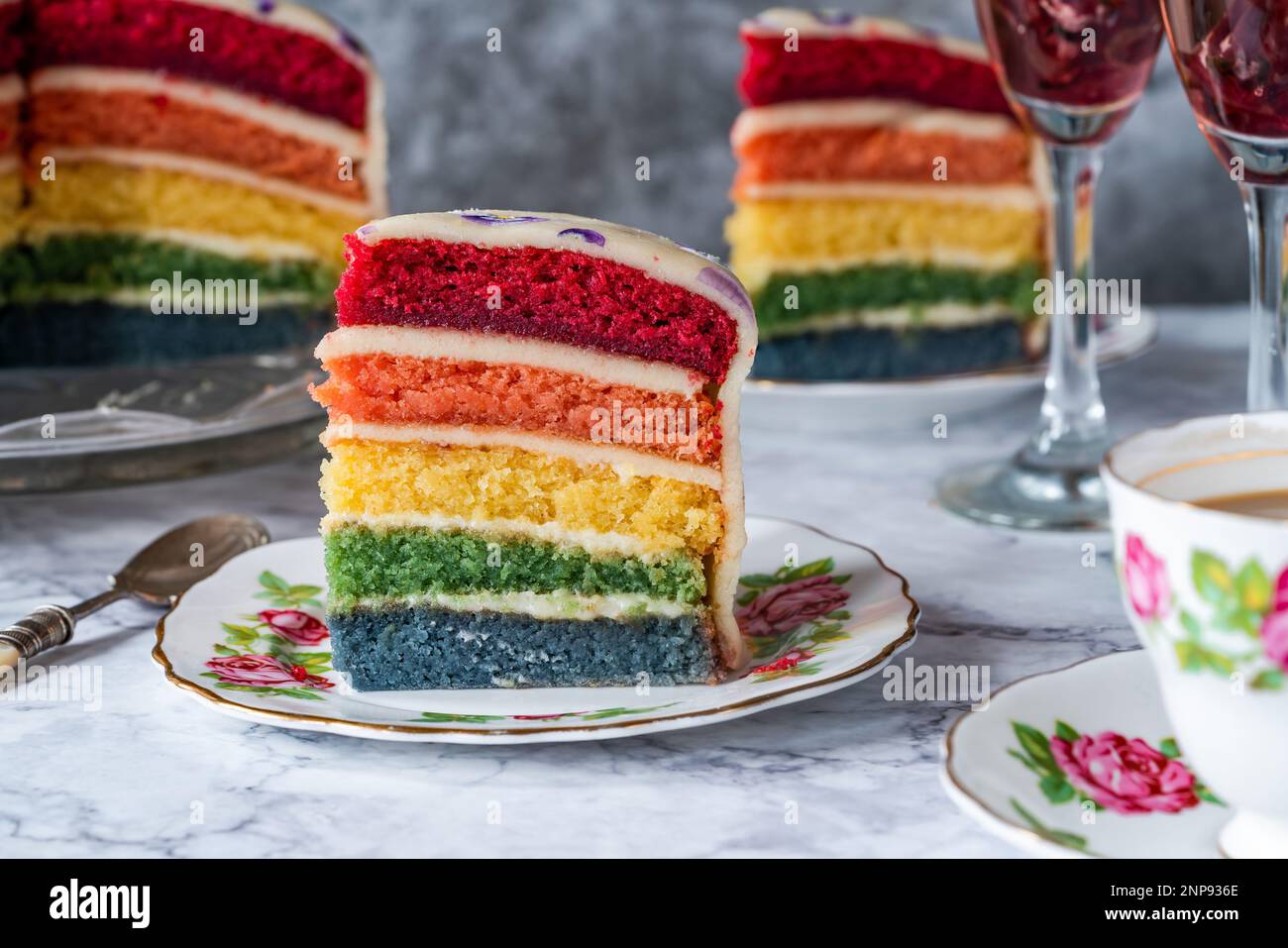 Multi layered rainbow cake - sweet afternoon dessert Stock Photo - Alamy