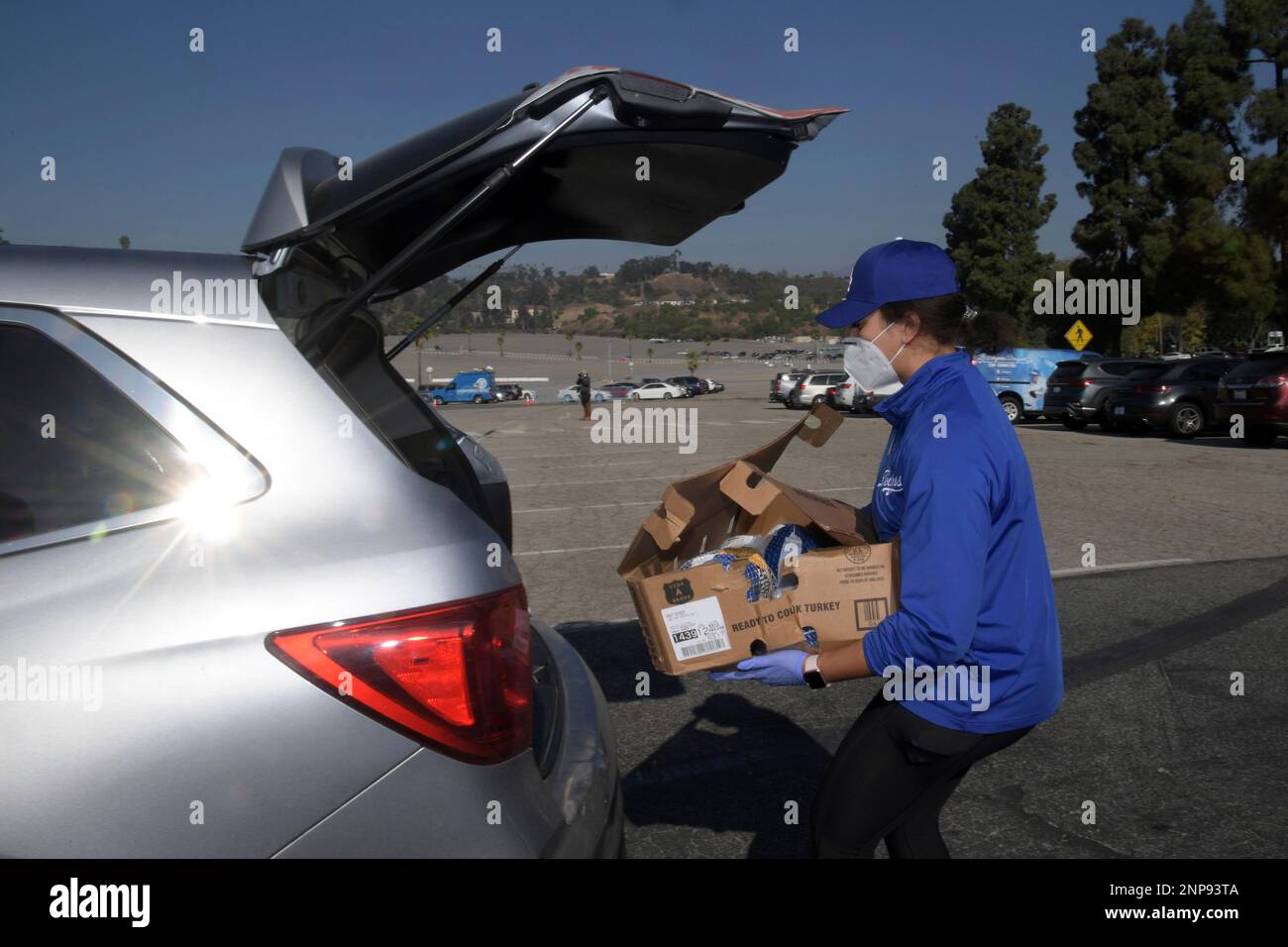 Volunteers distribute meals at the Los Angeles Dodgers Foundation 16th ...
