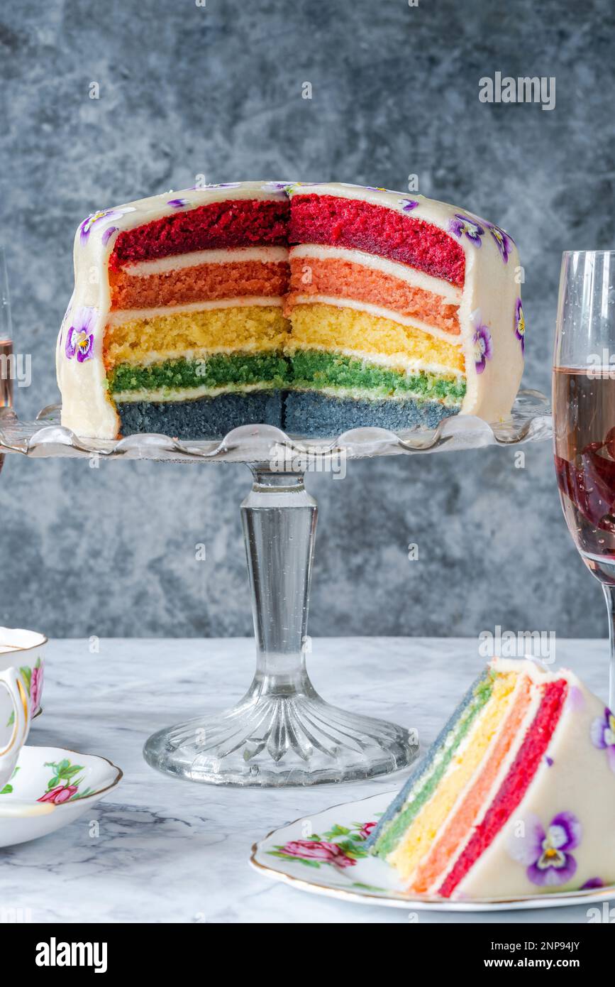 Multi layered rainbow cake - sweet afternoon dessert Stock Photo - Alamy